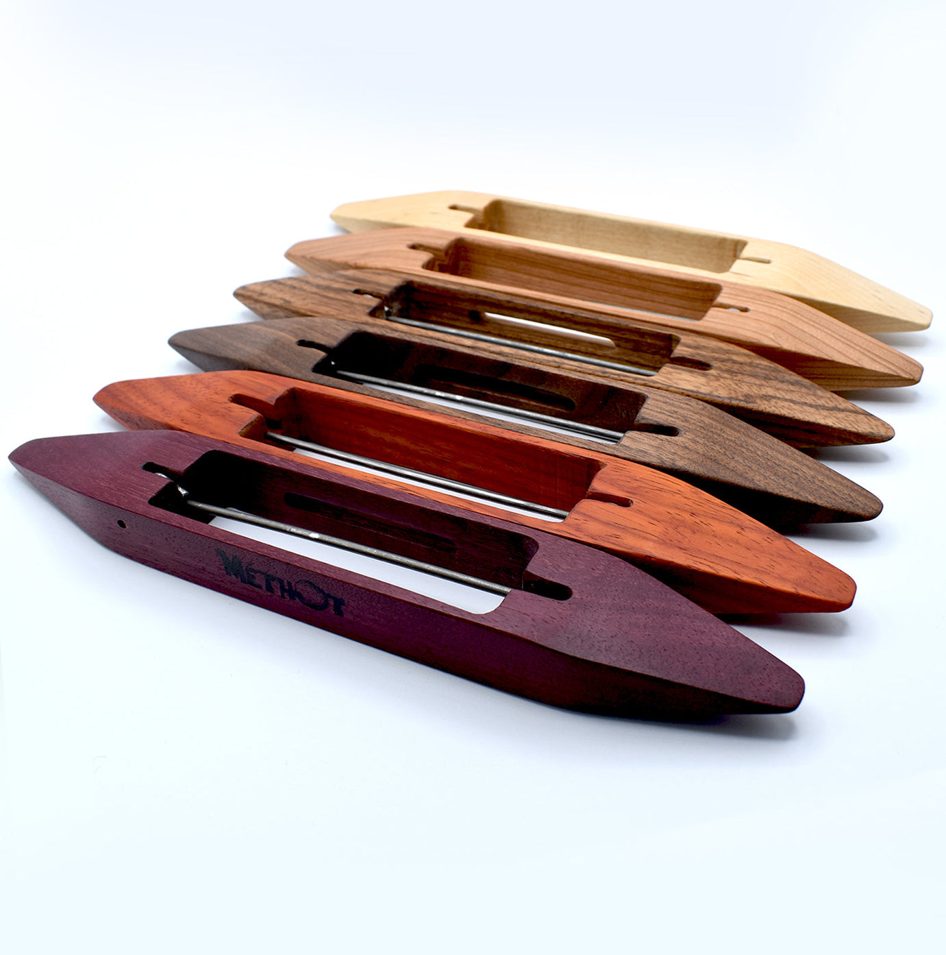 Handcrafted boat shuttles — Tisse et File